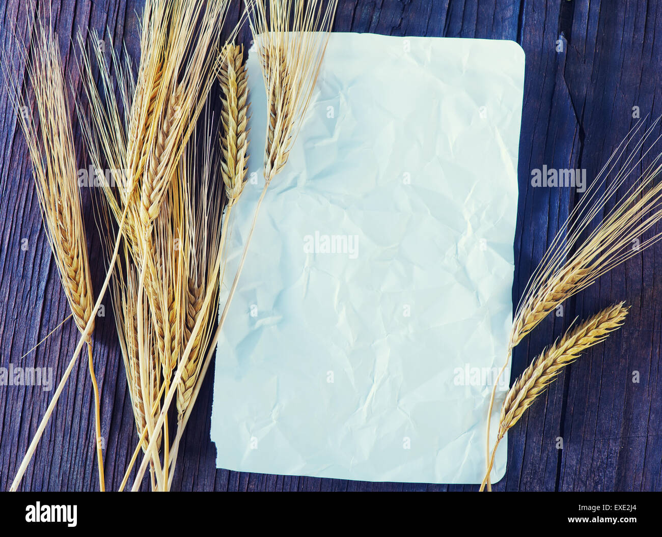 wheat and paper on the wooden background Stock Photo - Alamy