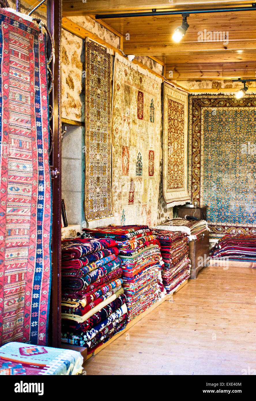 Inside of a store selling traditional rugs and carpets in Turkey Stock ...