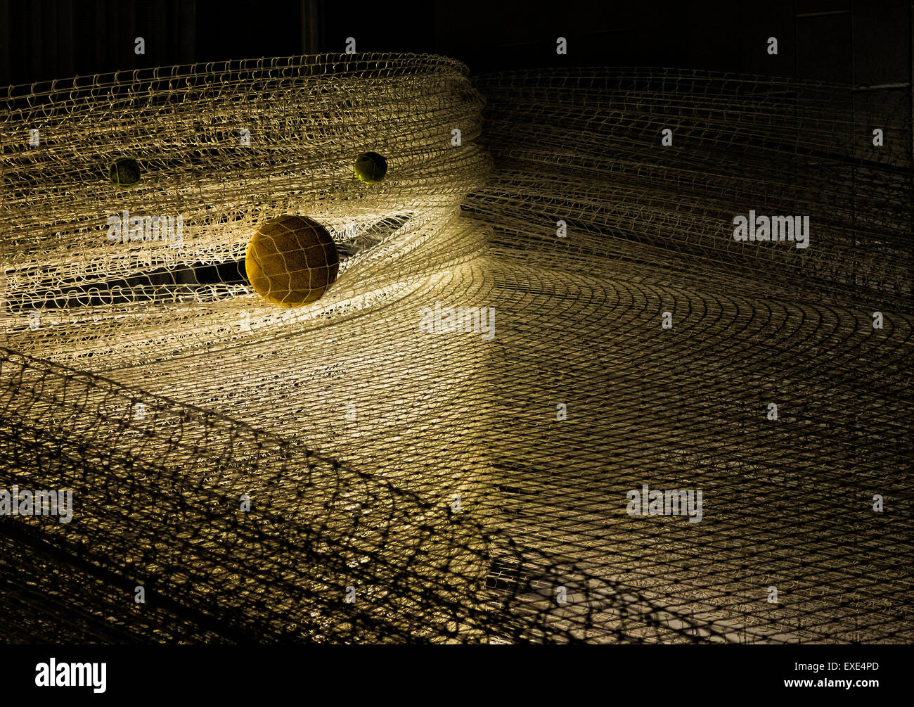 Three balls trapped on the top of the net in a sport center in ...