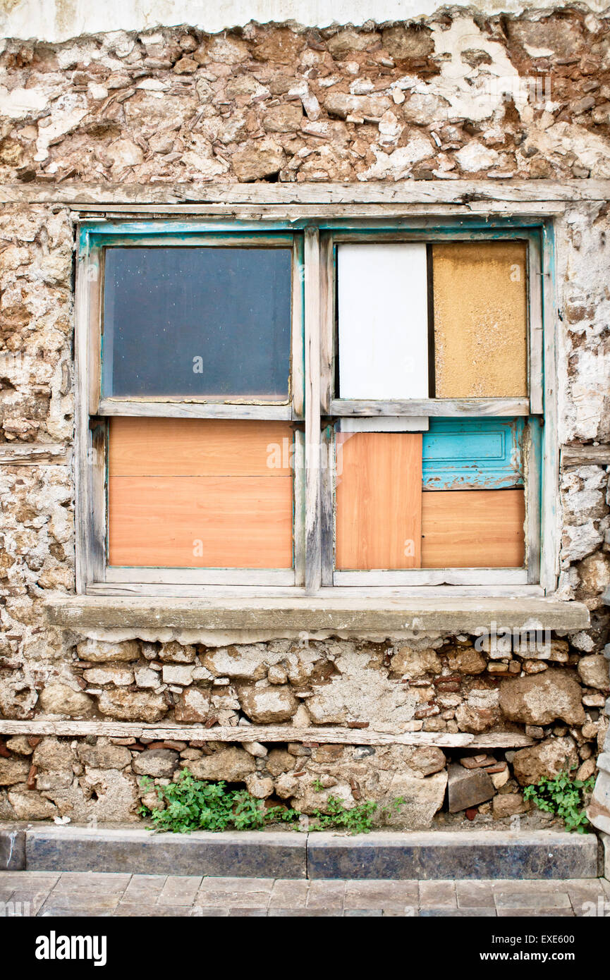 A window boarded up by wooden panels in an old house Stock Photo - Alamy