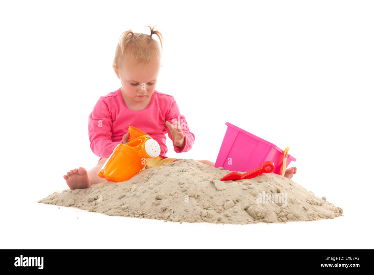 Little toddler playing in the sand isolated over white background Stock ...
