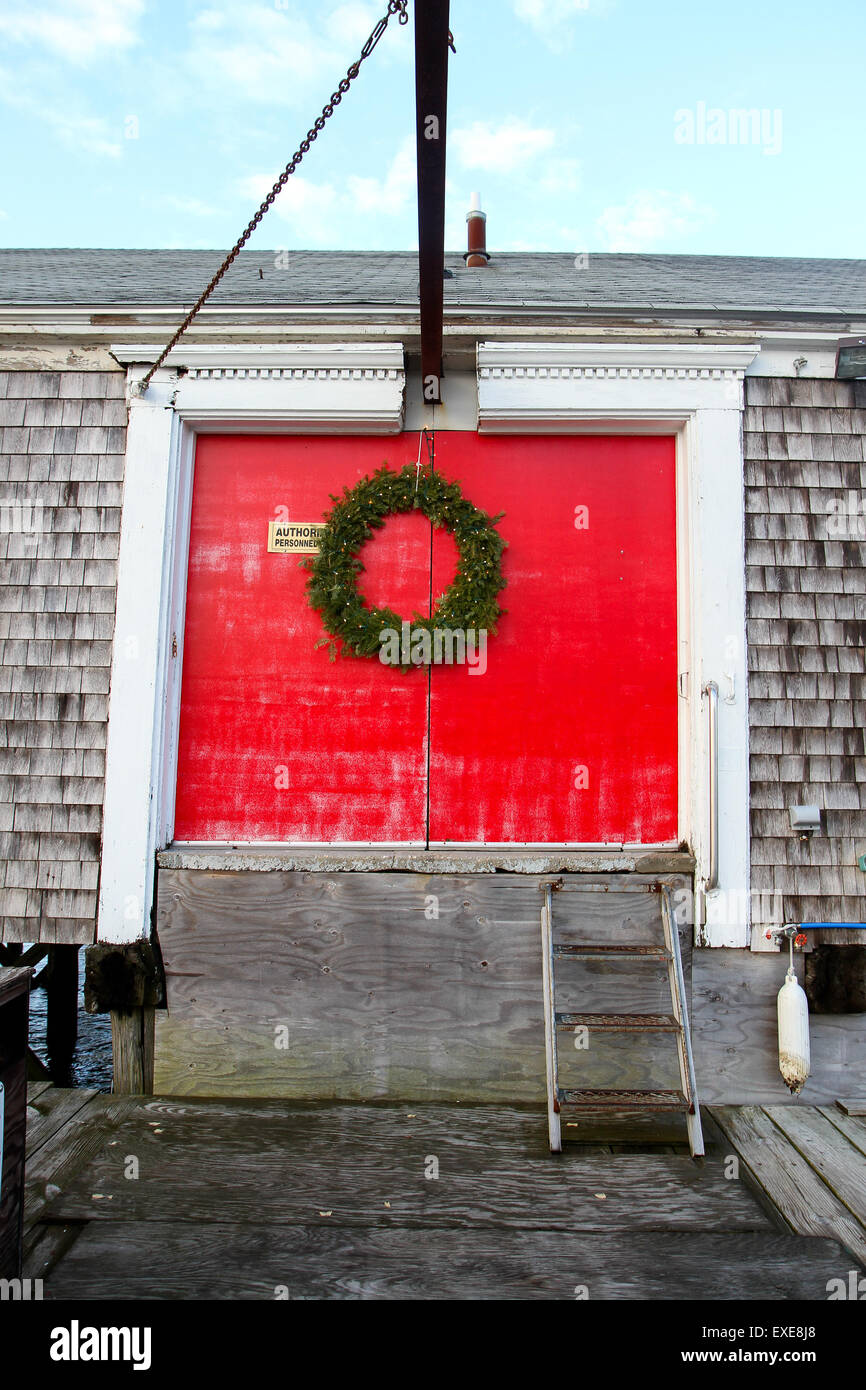 A holiday wreath on the red doors of a building at the Millway Marina ...