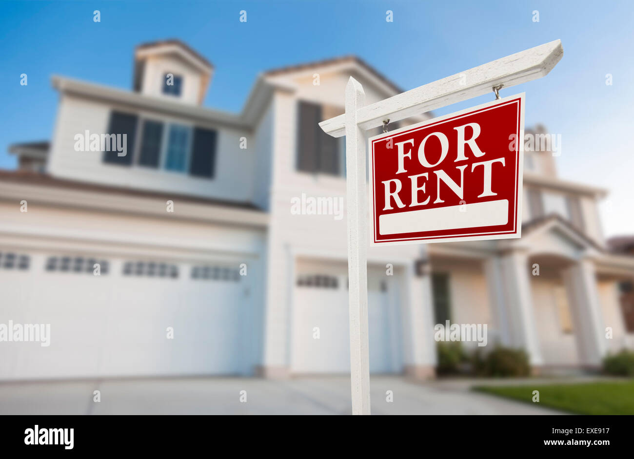 Red For Rent Real Estate Sign in Front of Beautiful House Stock Photo ...