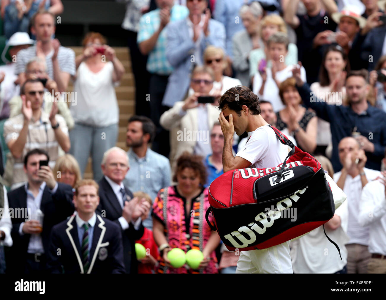 London, Britain. 12th July, 2015. Roger Federer of Switzerland leaves ...