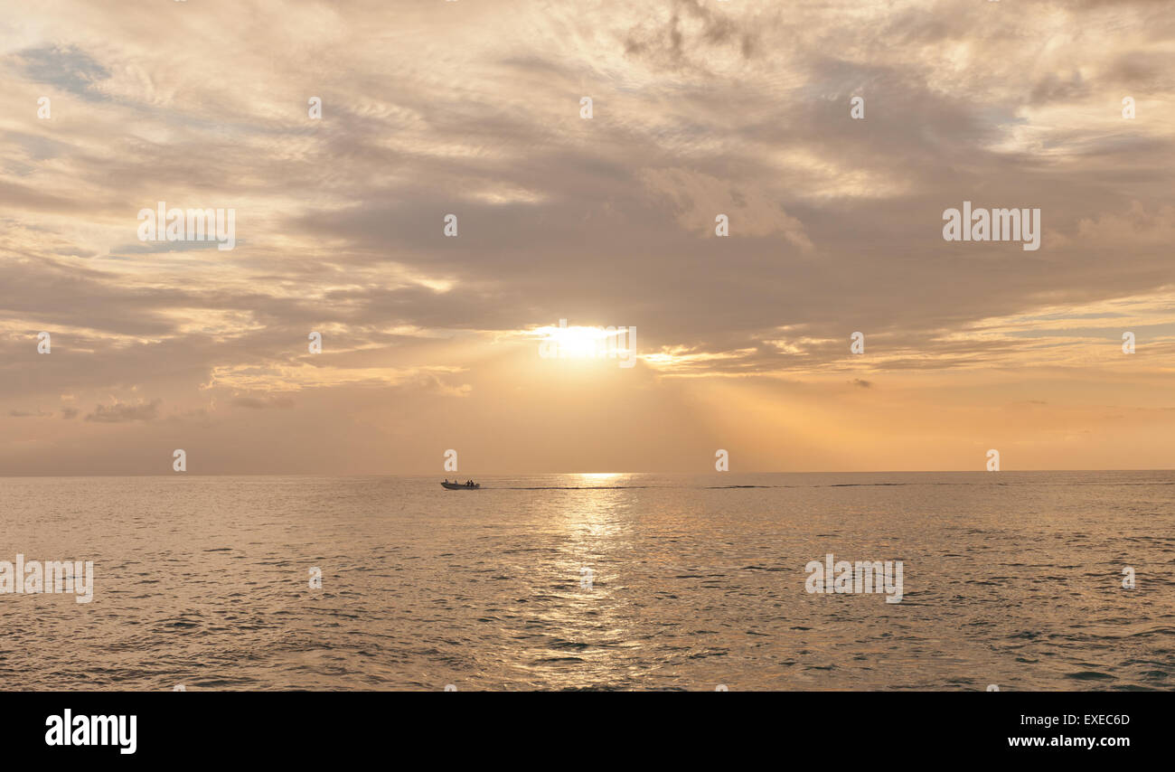 Summer sunset on the Caribbean seashore of Grand Cayman Island, Cayman ...