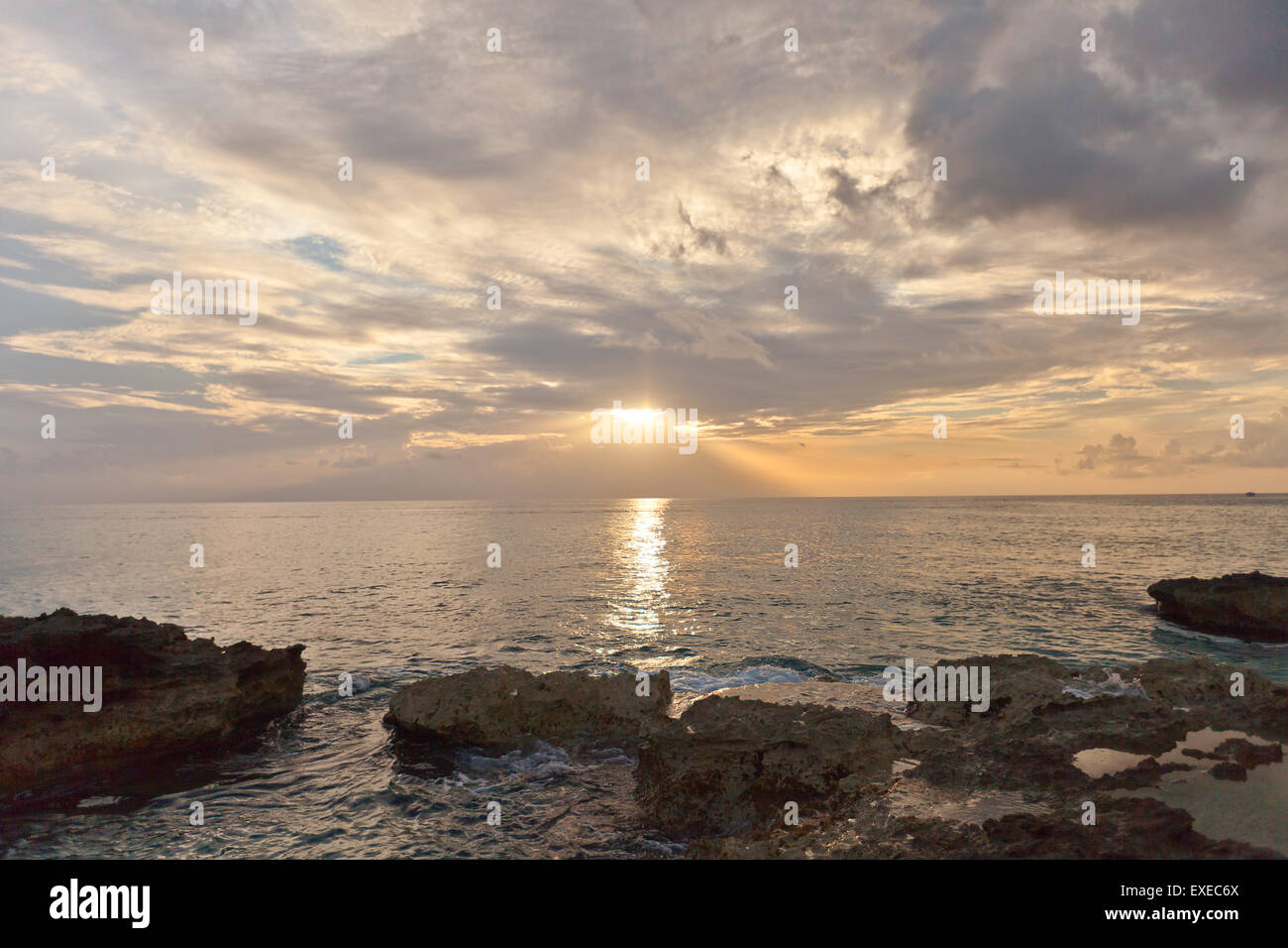 Summer sunset on the seashore of Grand Cayman Island, Cayman Islands ...