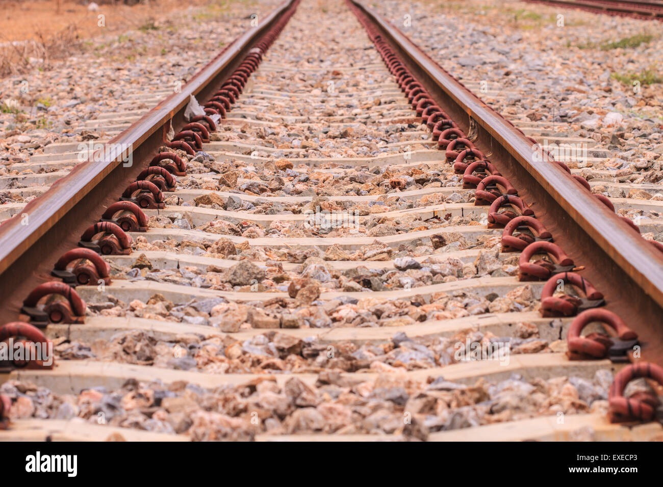 Close up of empty straight railroad track Stock Photo - Alamy