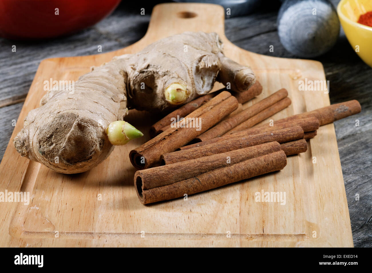 Still-life with ginger and cinnamon on an old kitchen table Stock Photo ...