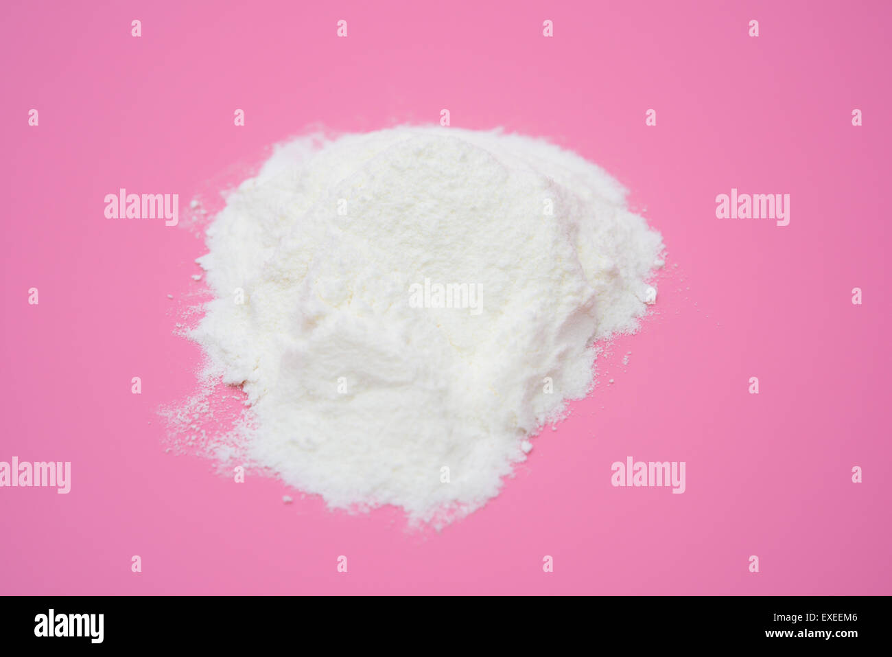 powdered milk on pink background Stock Photo - Alamy