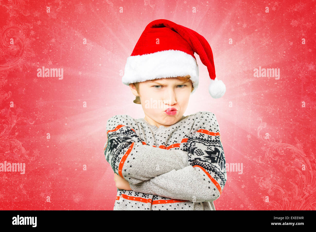 Portrait of a boy in christmas hat with angry and unhappy gesture Stock ...