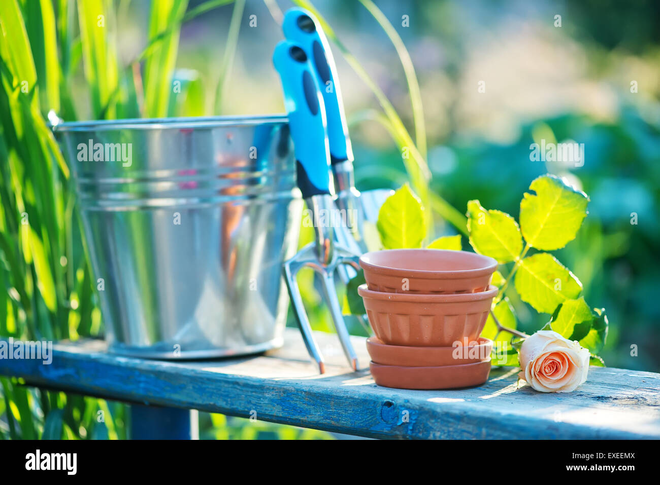 garden tools on the wooden background in the garden Stock Photo - Alamy