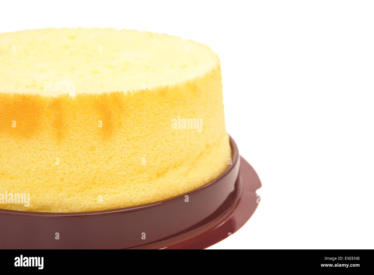 side view home made round sponge cake on white with clipping path and ...