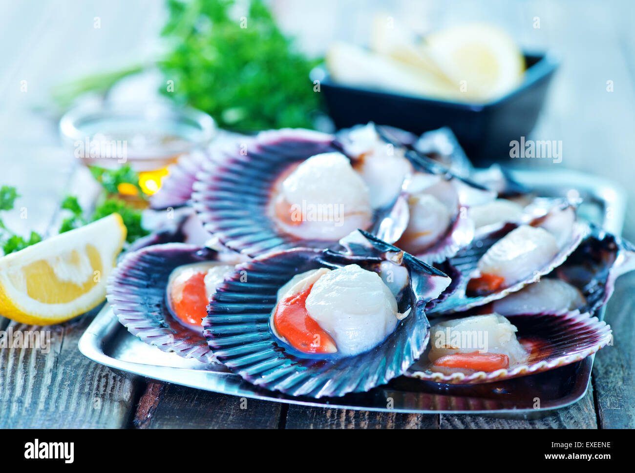 scallop with caviar on shell and on a table Stock Photo - Alamy