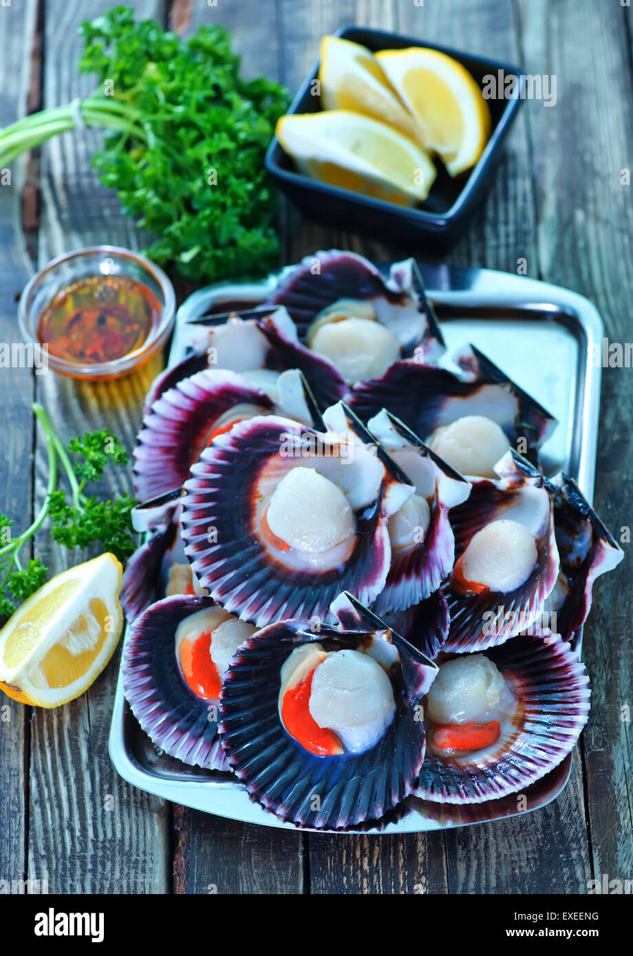 scallop with caviar on shell and on a table Stock Photo - Alamy
