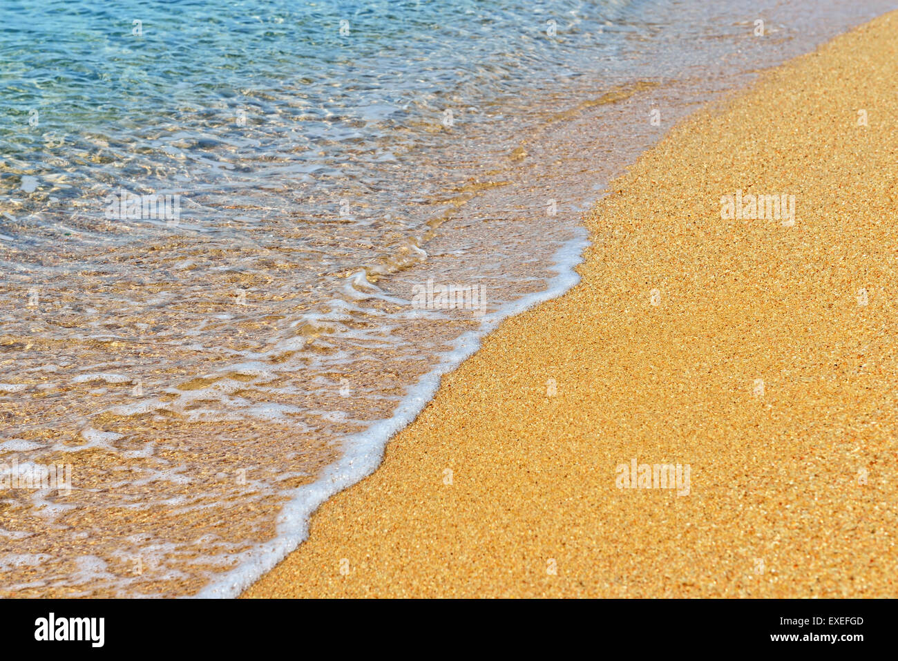 Sandy beach and sea waves in sunny day very detailed Stock Photo - Alamy