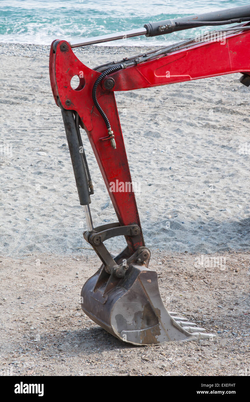 detail of red and black excavator's arm with bucket on a beach Stock ...