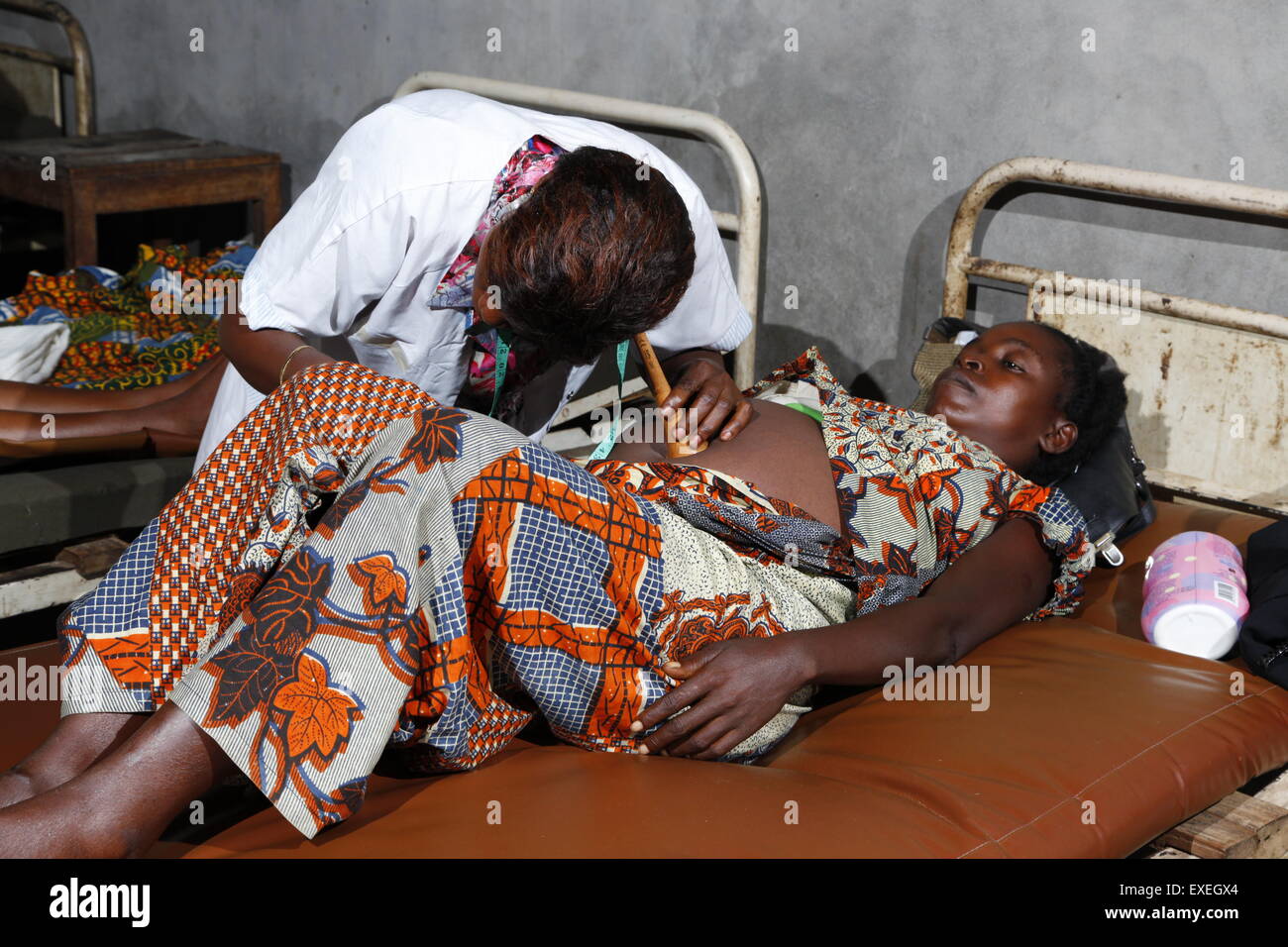 Pregnant woman being examined by a doctor, at the hospital, Matamba ...