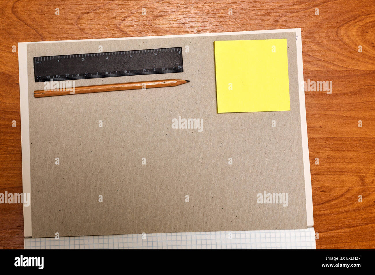 Pencils, rulers and stickers are on school notebook. Blank sheets of ...