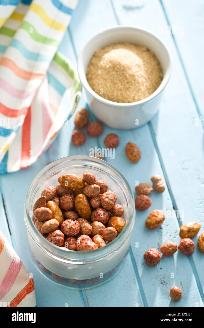 various sugared nuts in jar on kitchen table Stock Photo - Alamy