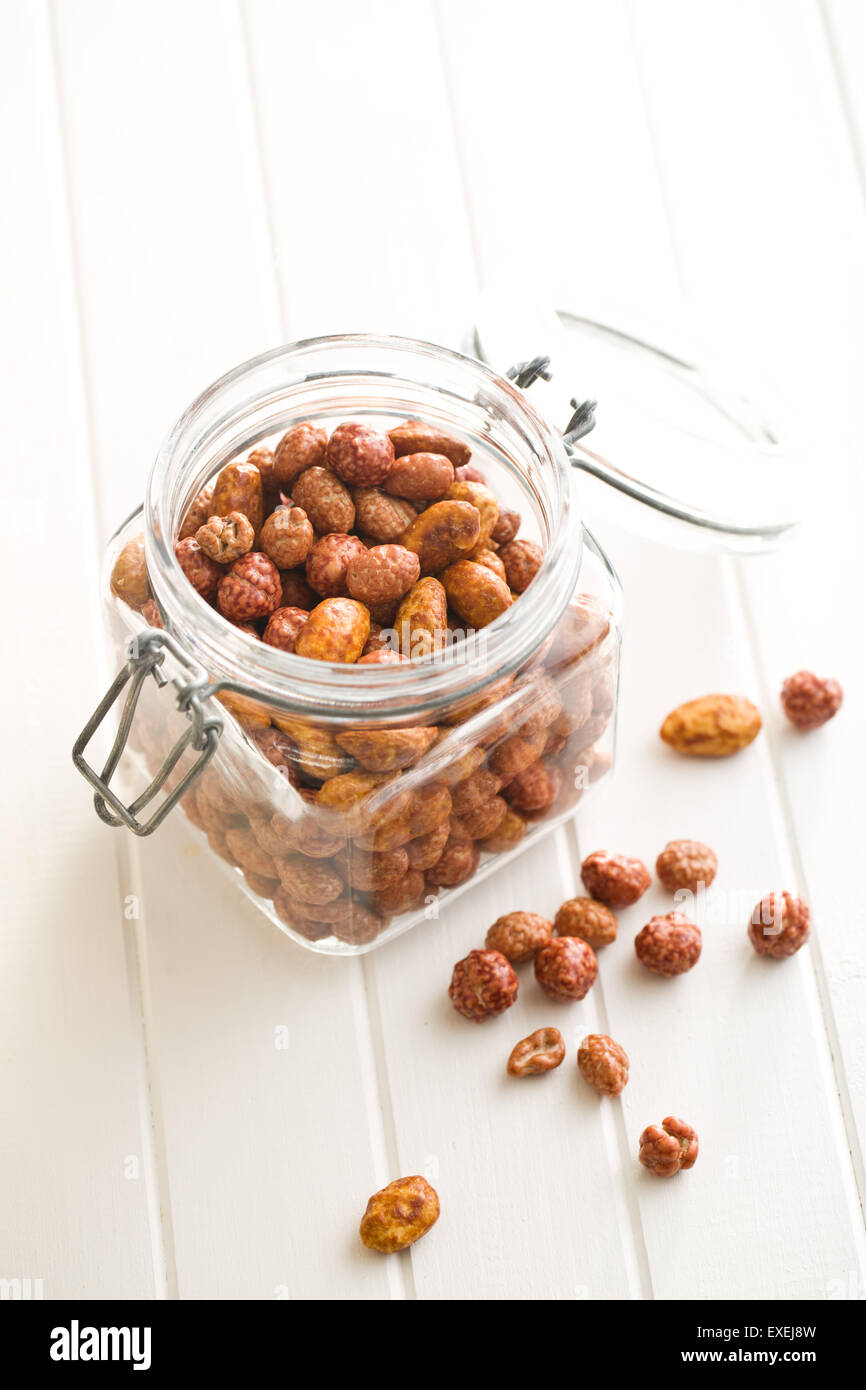 various sugared nuts in jar on kitchen table Stock Photo - Alamy