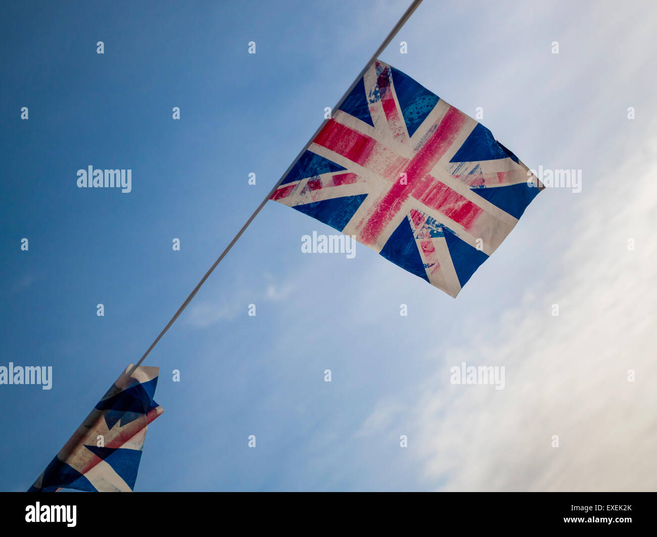 faded Union flag against a blue sky Stock Photo - Alamy