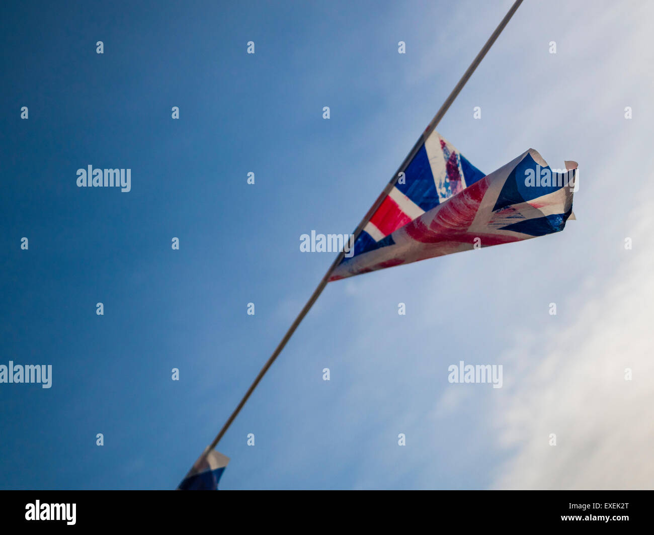 faded Union flag against a blue sky Stock Photo - Alamy