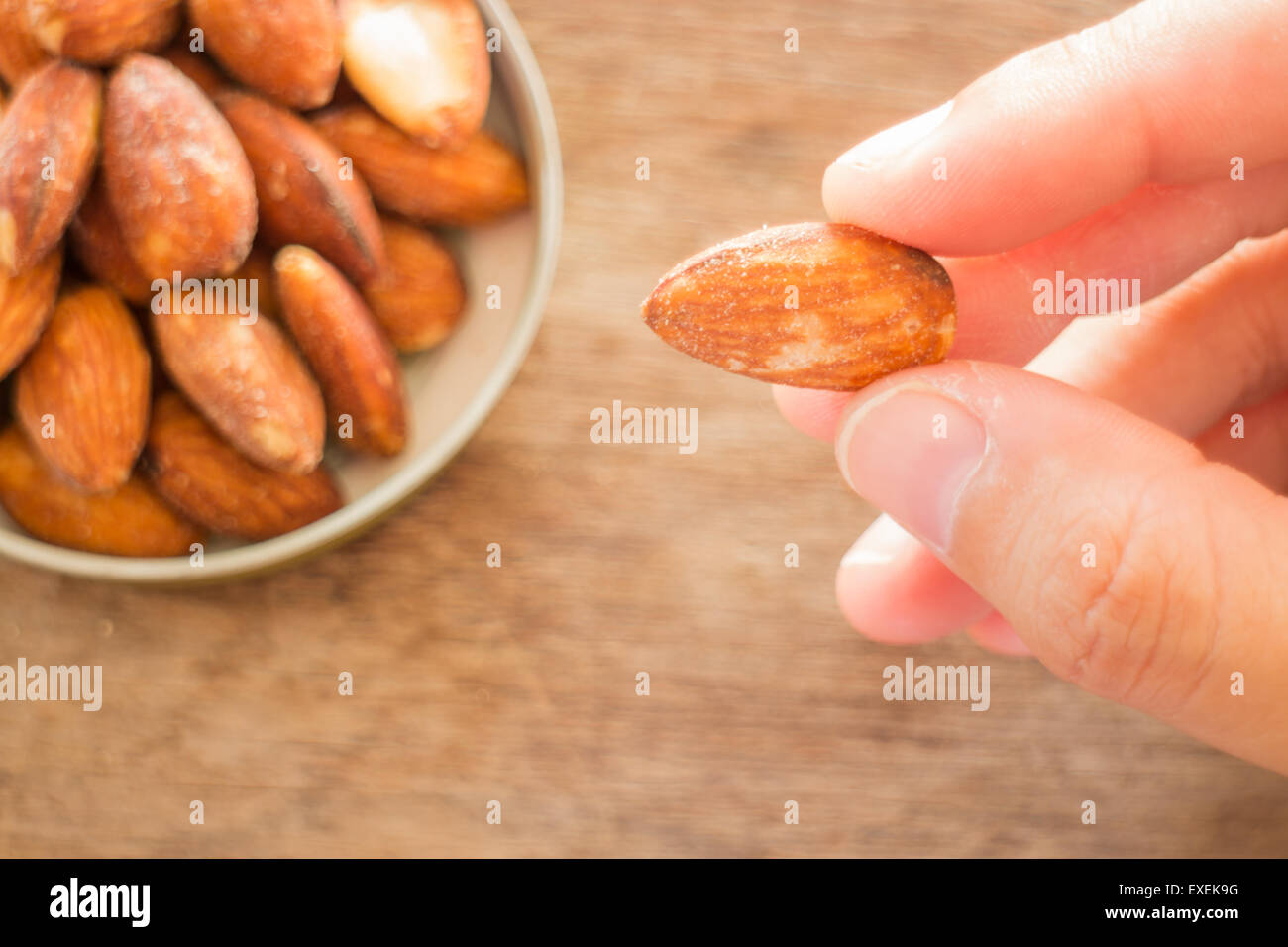 Almond grain roast on hand hi-res stock photography and images - Alamy