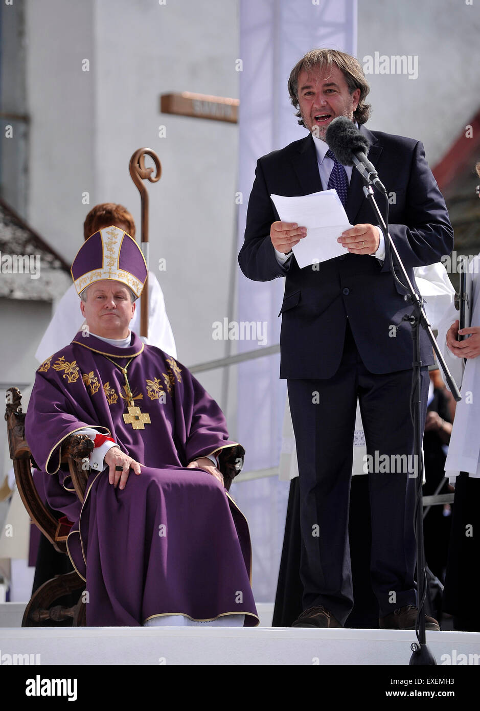 Milos Dolezal (right) speaks to pilgrims during the ceremony at which ...