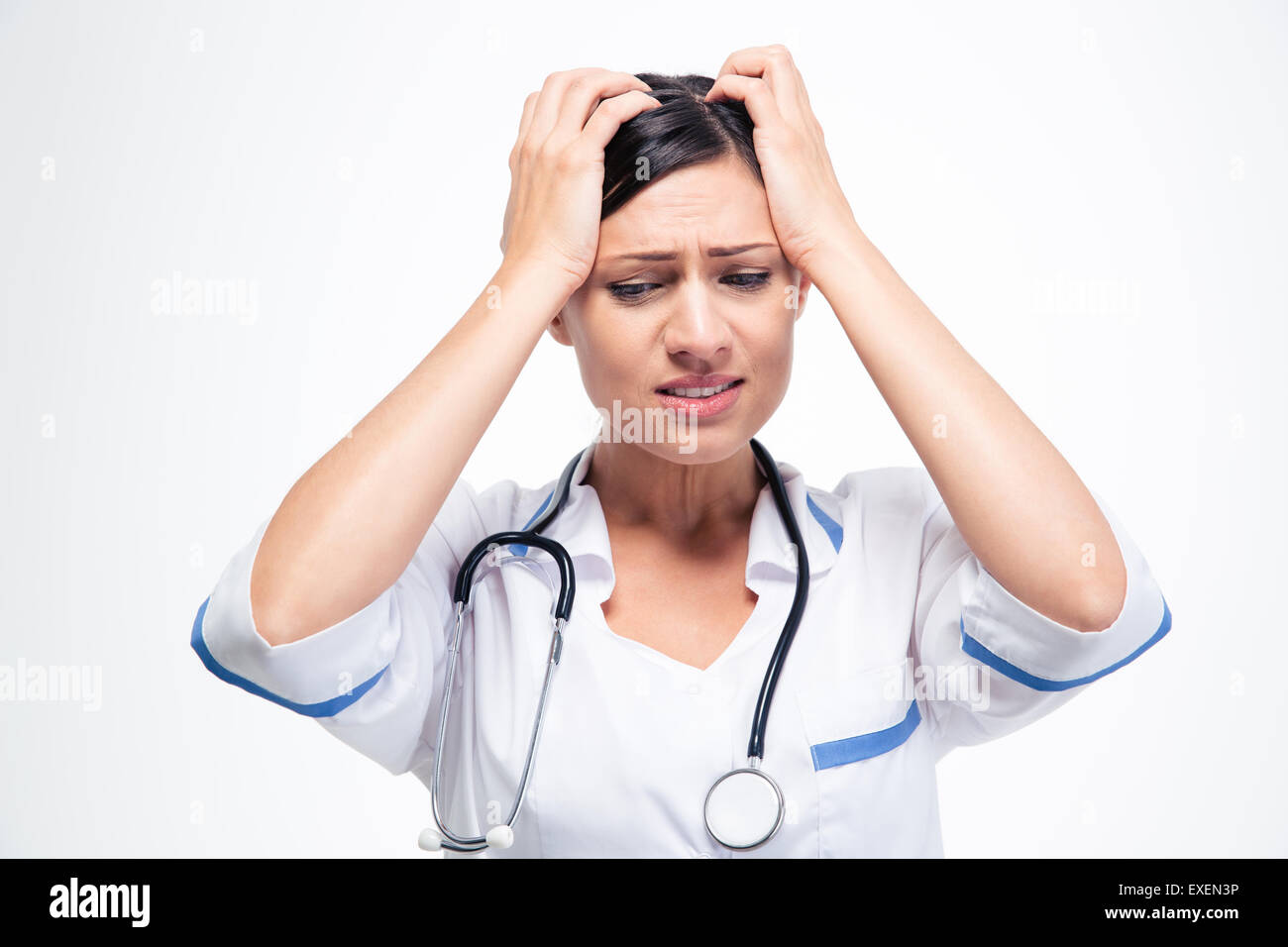 Depressed female doctor standing isolated on a white background Stock ...