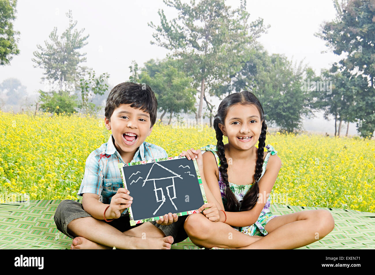 2 Rural kids Brother and sister farm Slate board showing Stock Photo ...