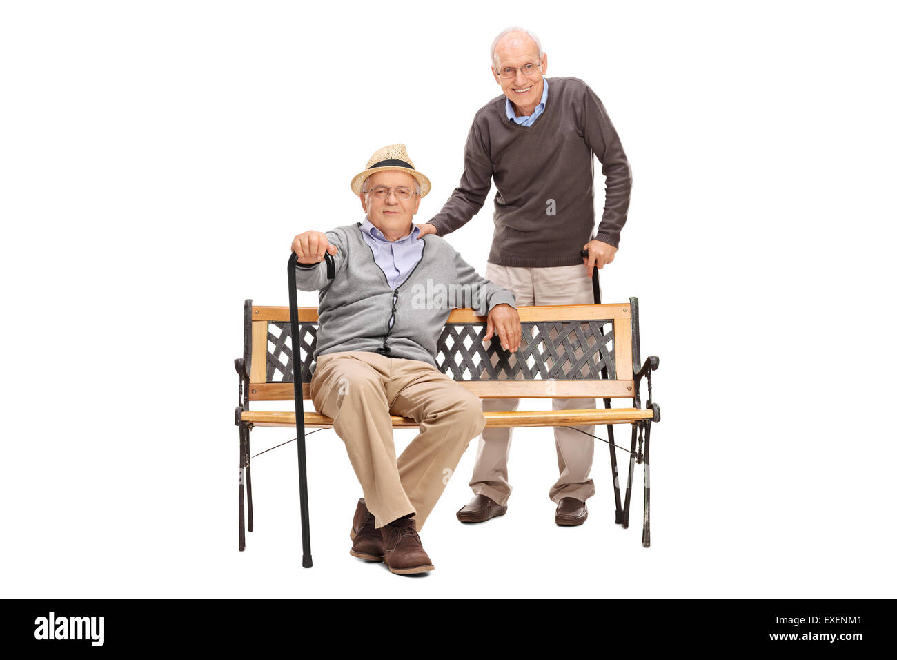 Full length portrait of a two senior old friends posing together seated ...