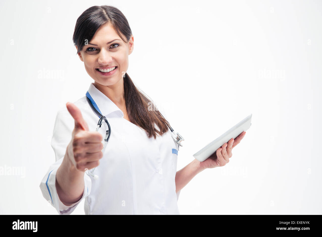 Smiling medical doctor holding tablet computer and showing thumb up ...