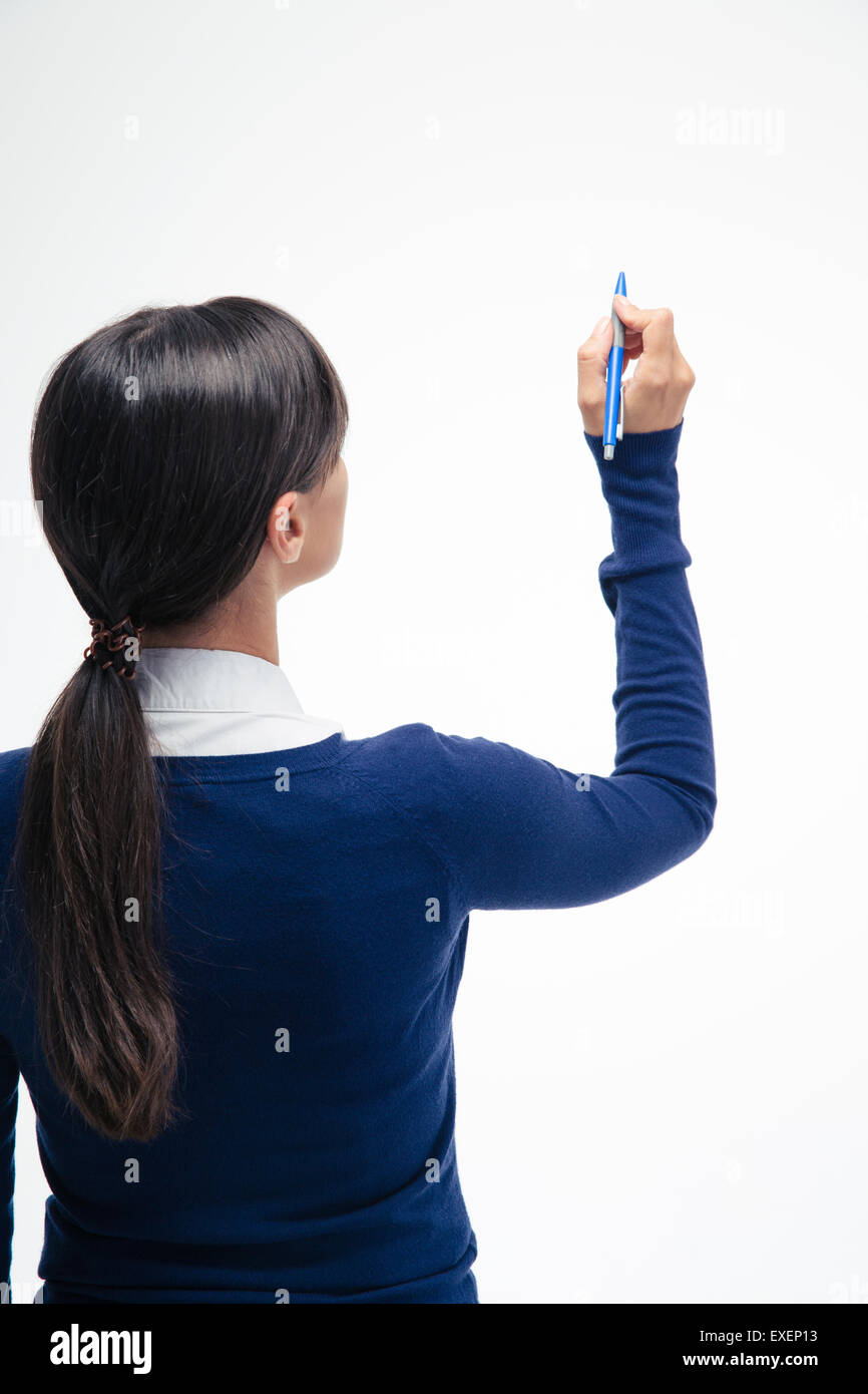 Back view portrait of a businesswoman writing something on invisible ...