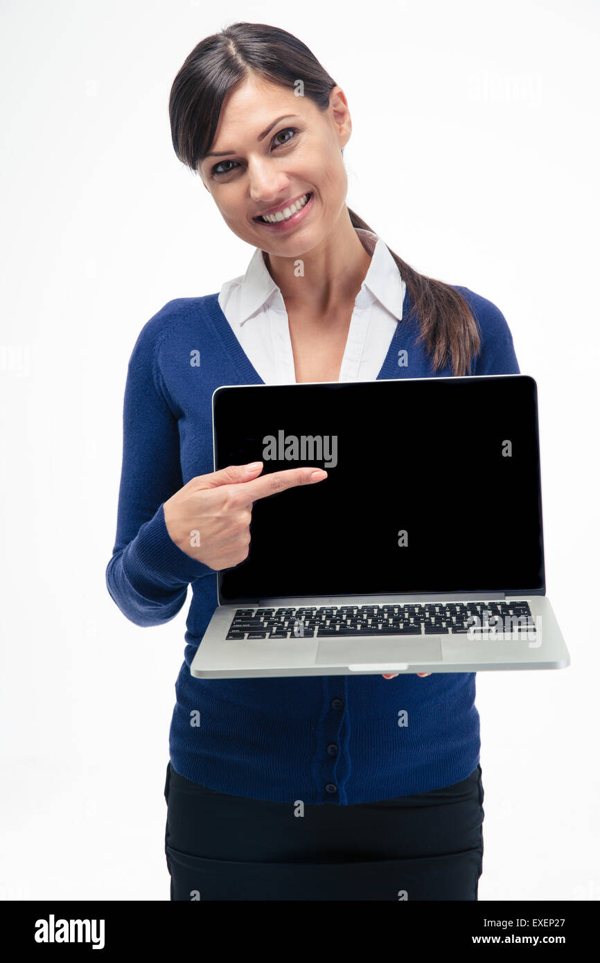 Smiling businesswoman pointing finger on laptop screen isolated on a ...