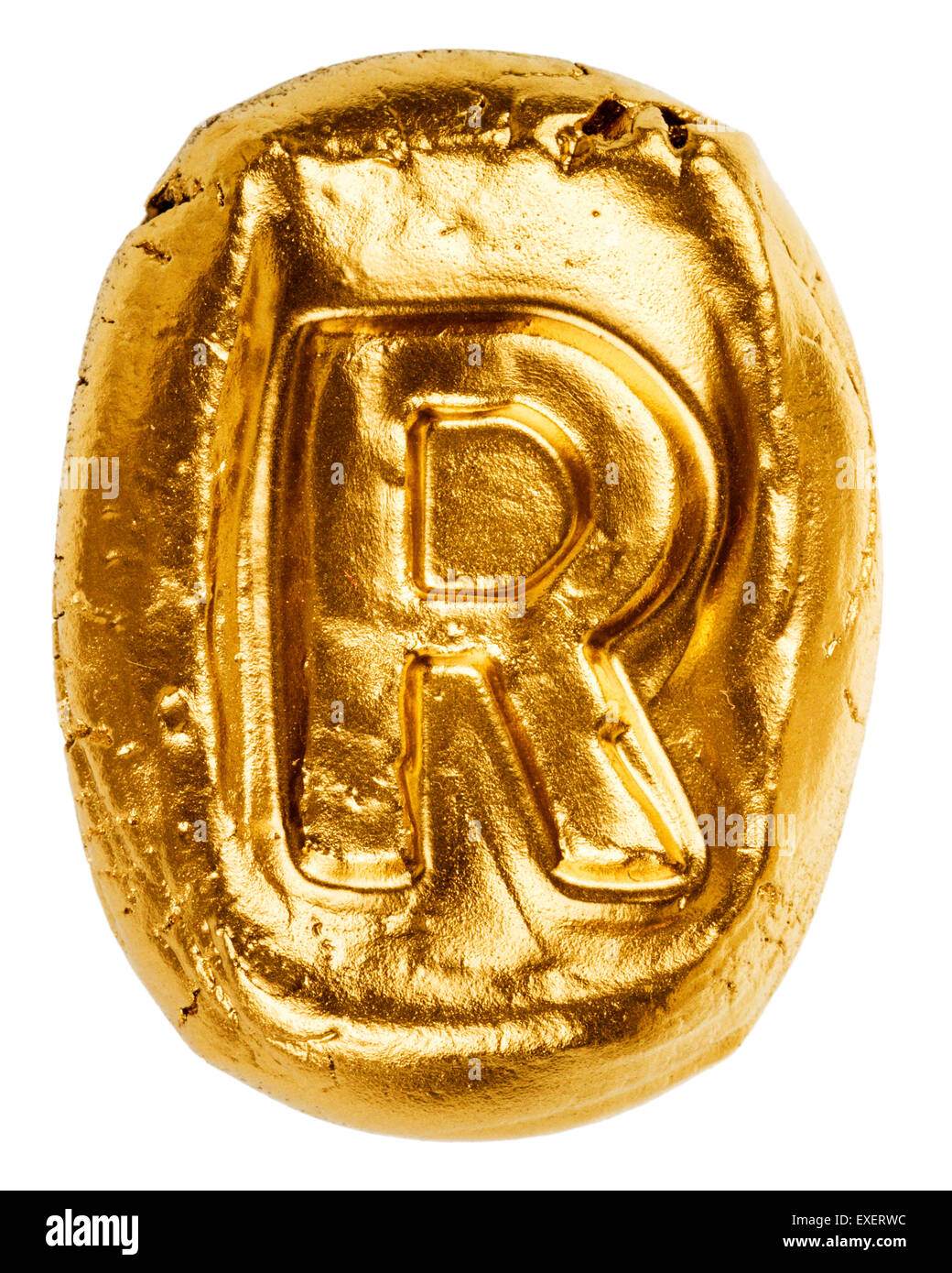 Handmade ceramic letter painted in gold cutout on white background ...