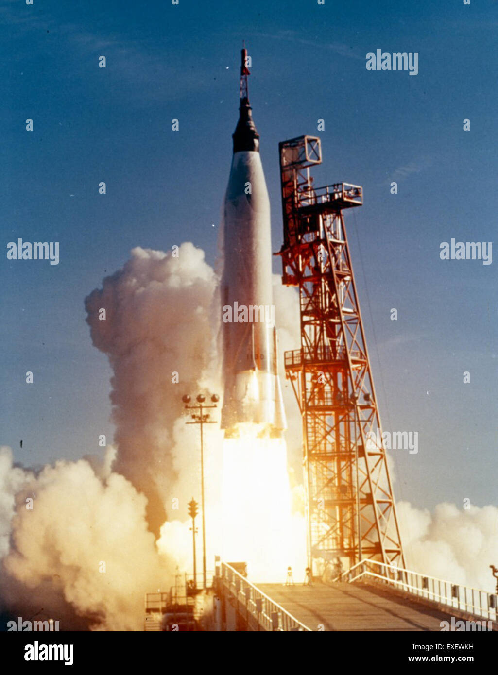 The photo captures the liftoff of the Mercury spacecraft carrying ...