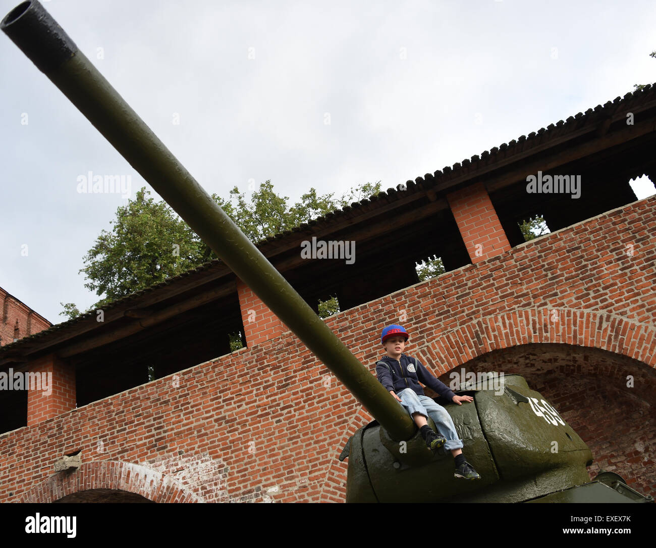 Nizhny Novgorod, Russia. 10th July, 2015. A boy sits on the canon pipe ...