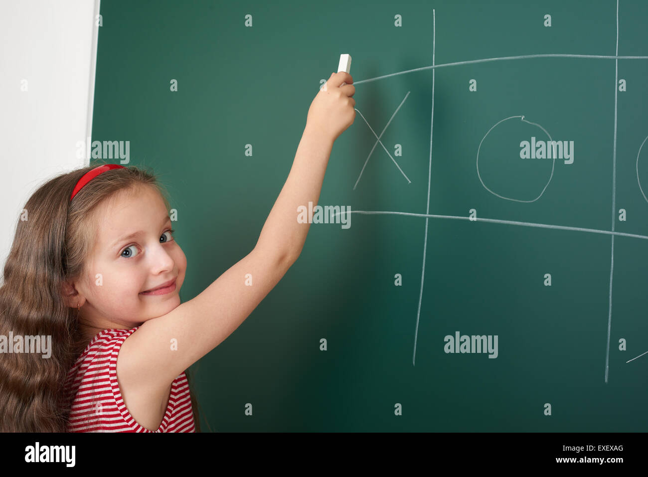 girl drawing on the school board Stock Photo - Alamy