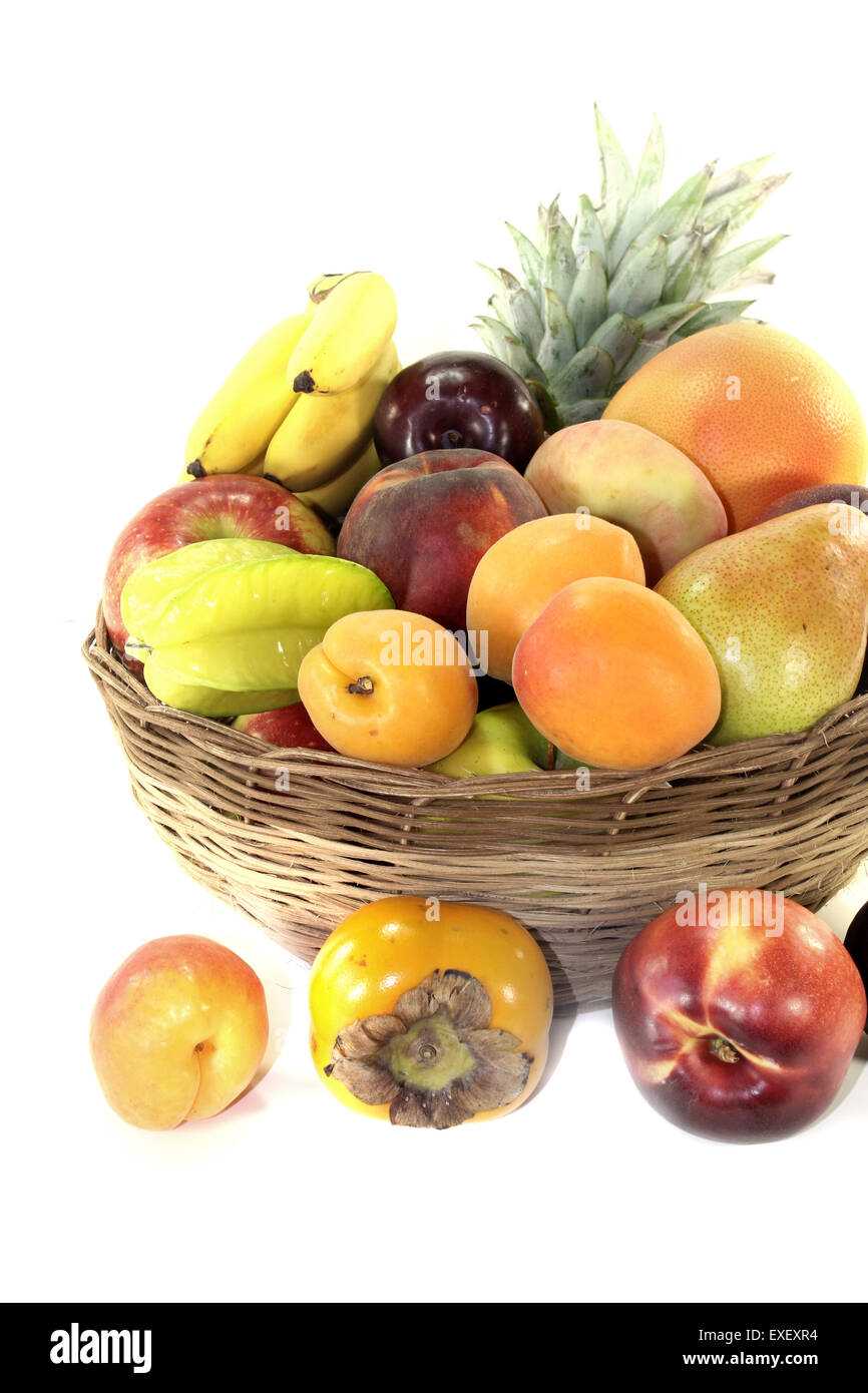 Fruit basket with various fruits on a light background Stock Photo - Alamy