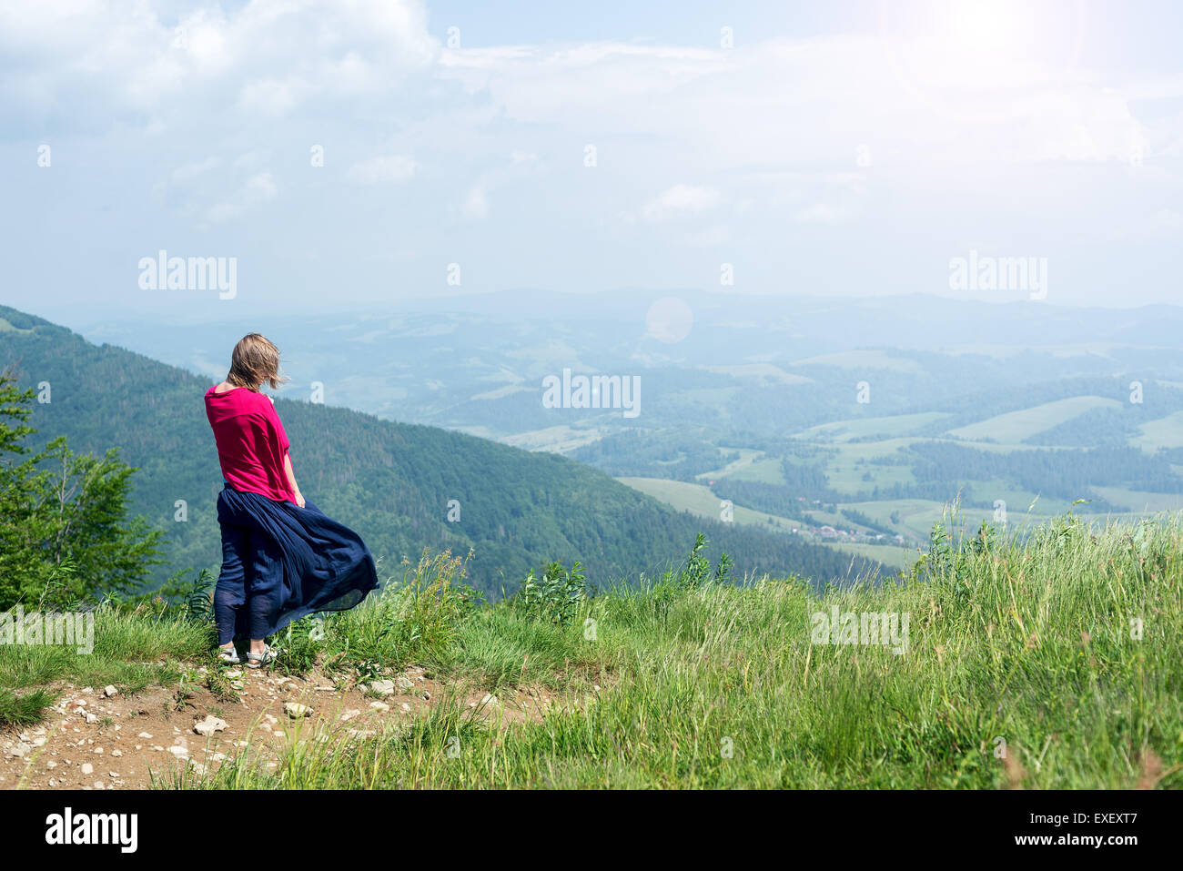 Woman staying at the Mountains Stock Photo - Alamy