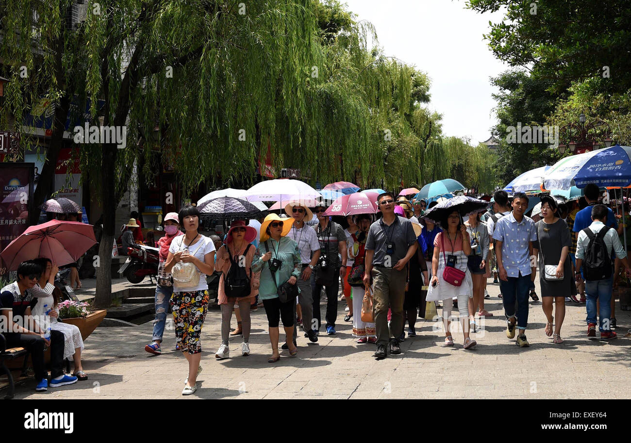Dali, Yunnan, China. 13th July, 2015. Tourists visit the ancient town ...