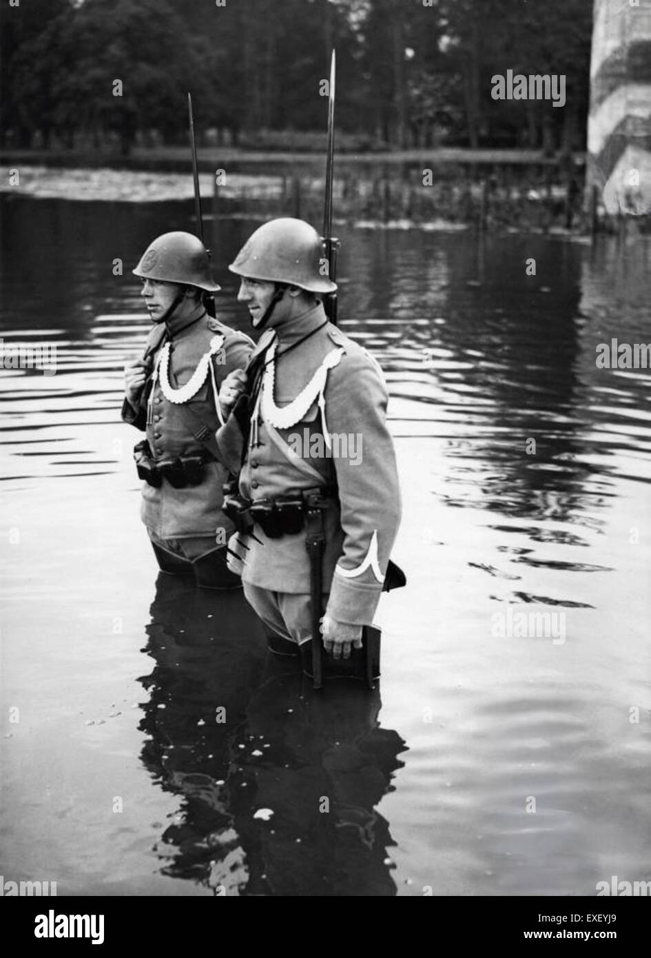 This image from 1939 captures Dutch soldiers standing guard during the ...