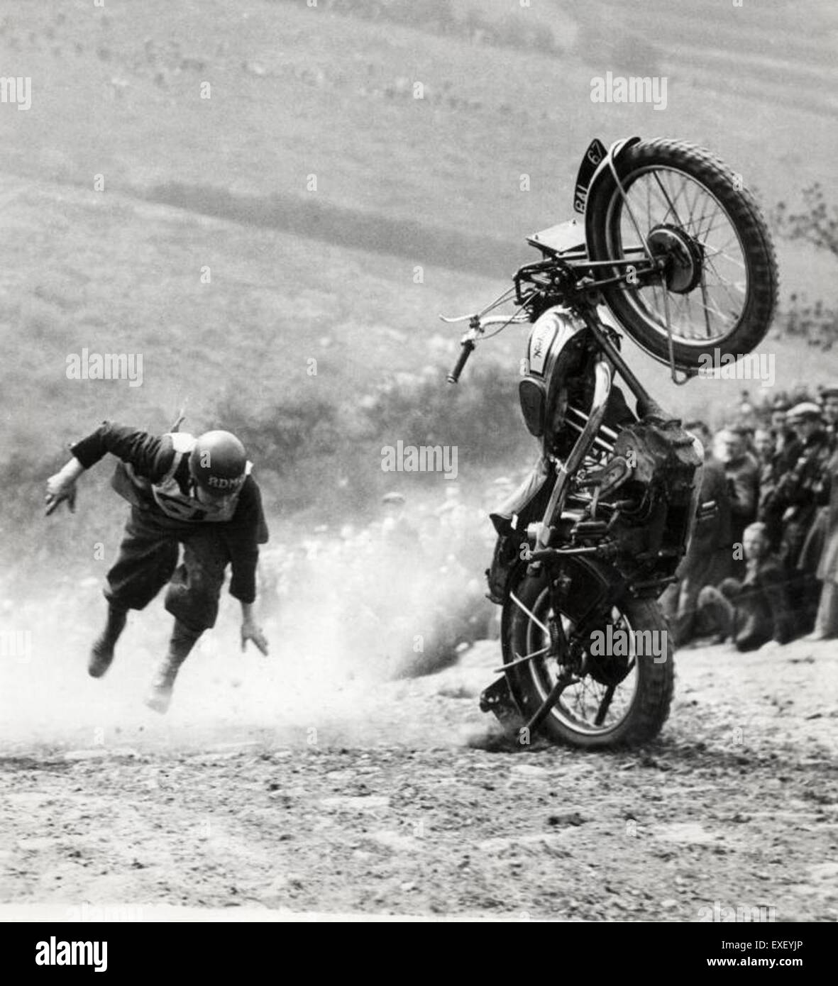 A photograph capturing the moment of a motor racing accident, where a ...