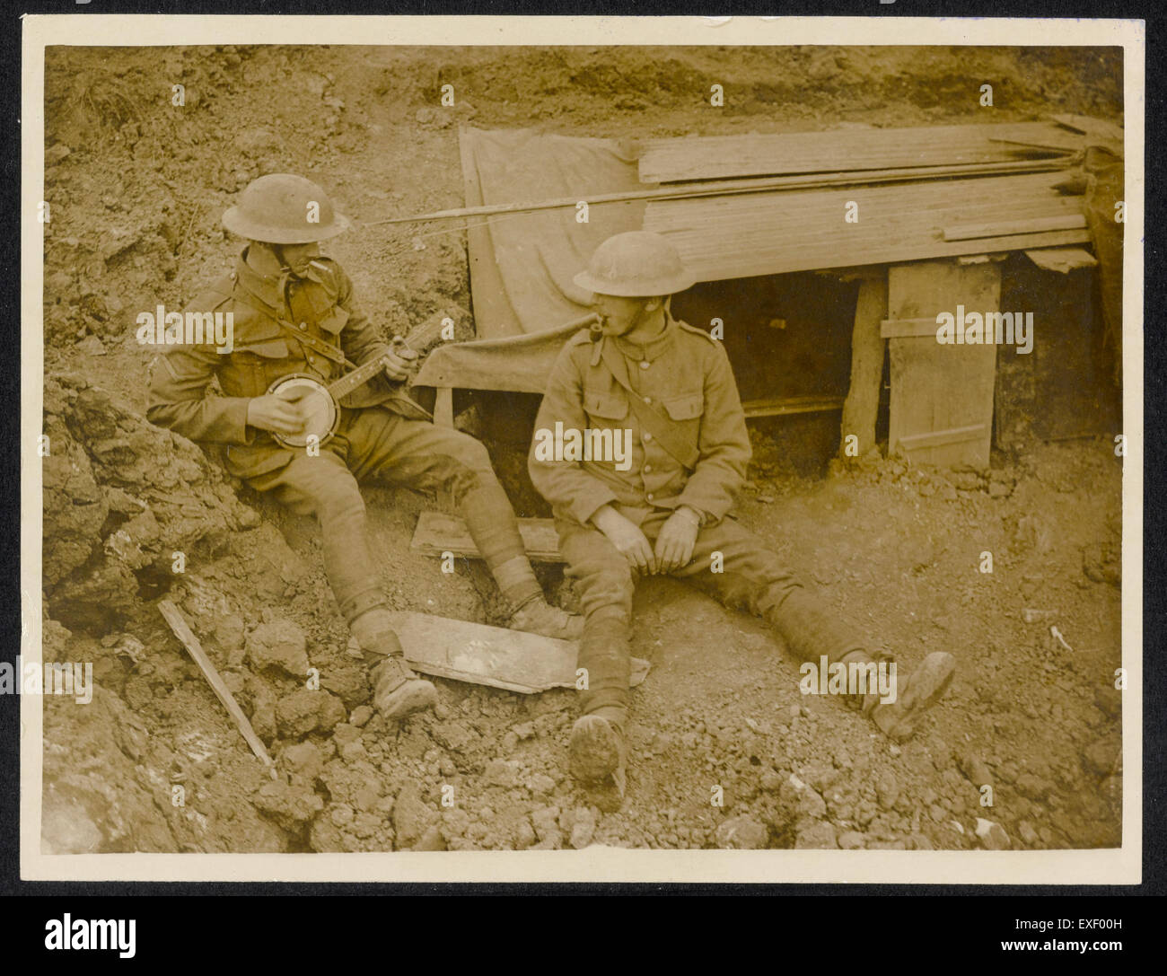 This historical image captures a group of soldiers enjoying a moment of ...