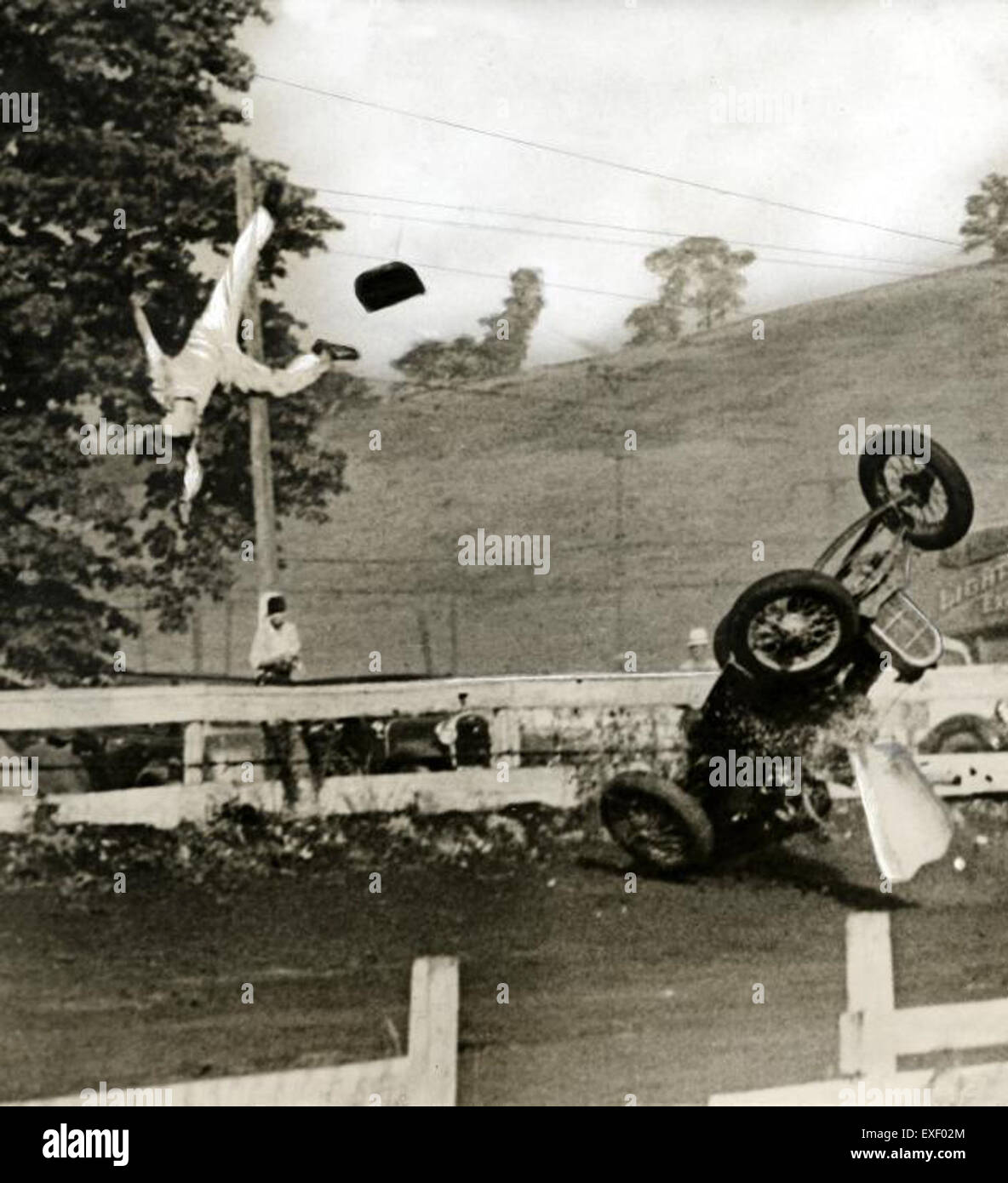 This photograph captures a moment from a racing car accident ...