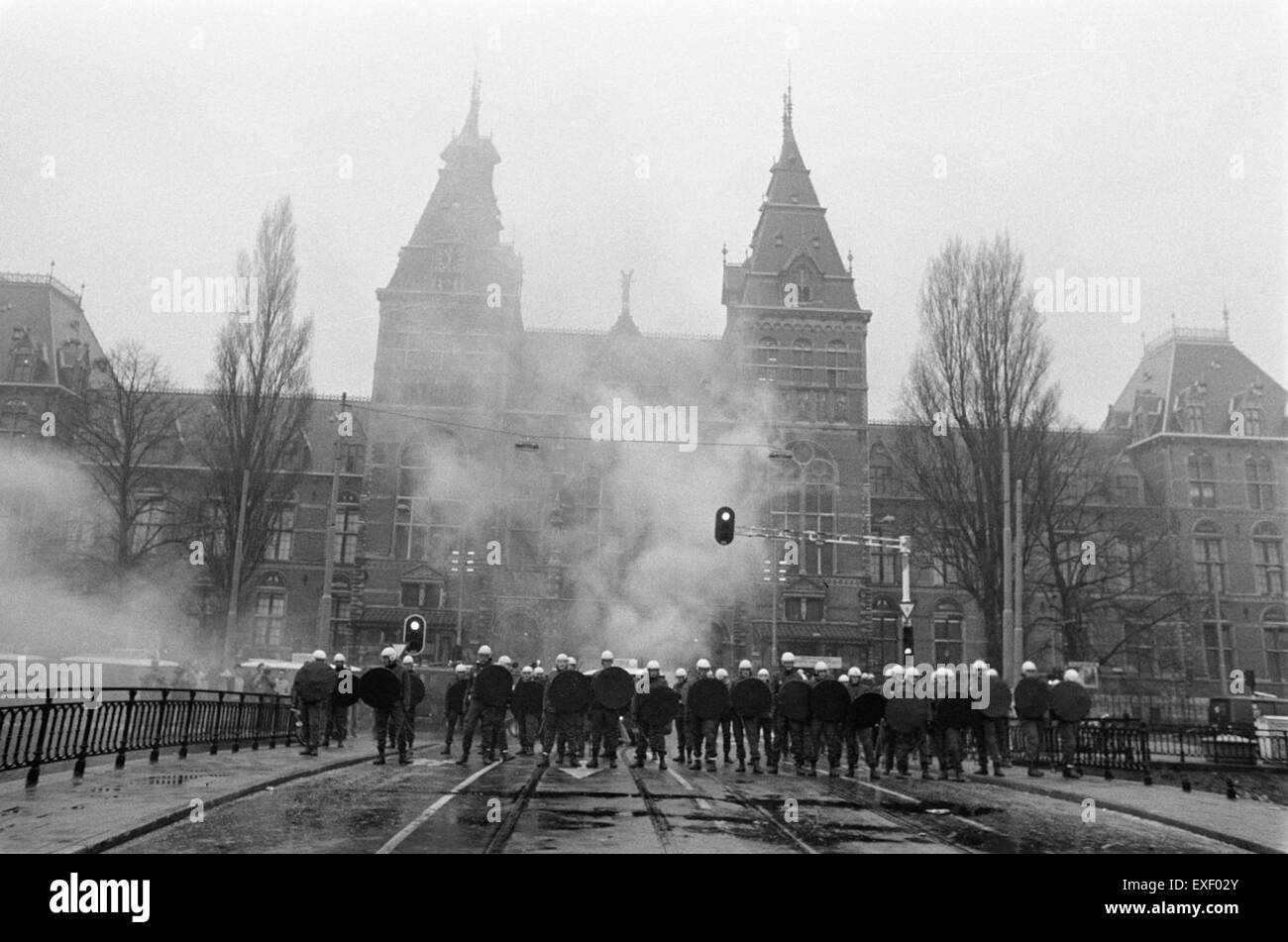 This photograph documents the evacuation of an illegal squatter ...
