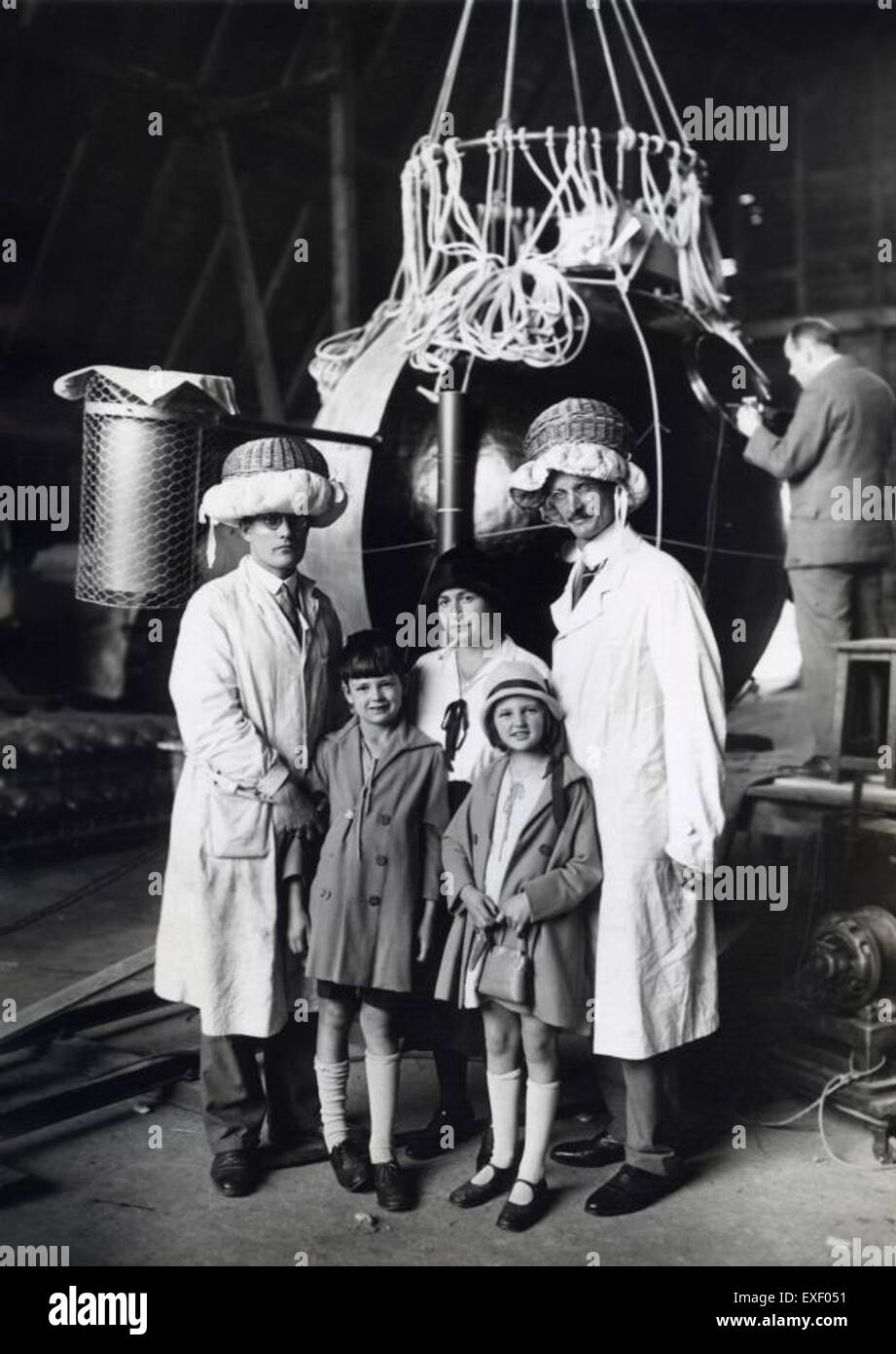 This historical image shows Auguste Piccard with his family, standing ...