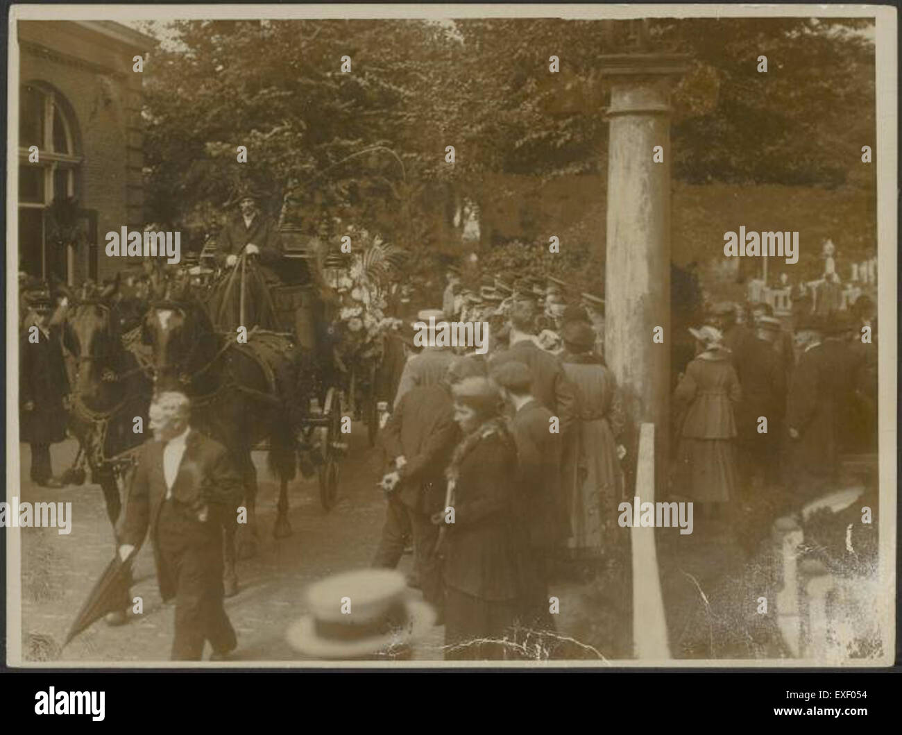 This image shows a funeral ceremony for a victim of a plane crash. The ...