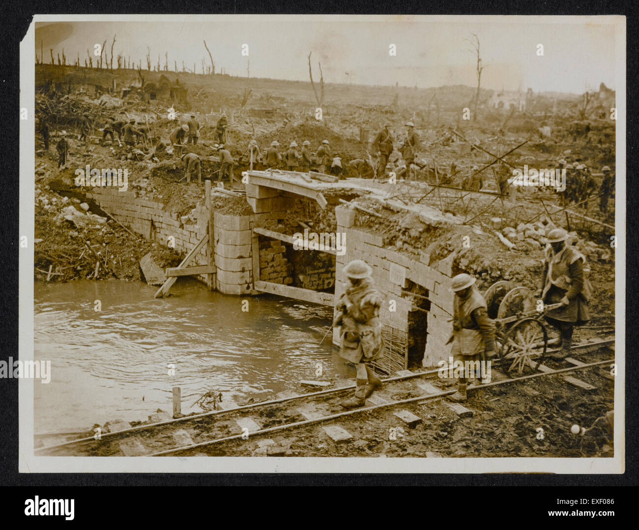 This photograph depicts workers repairing a lock bridge, showcasing the ...