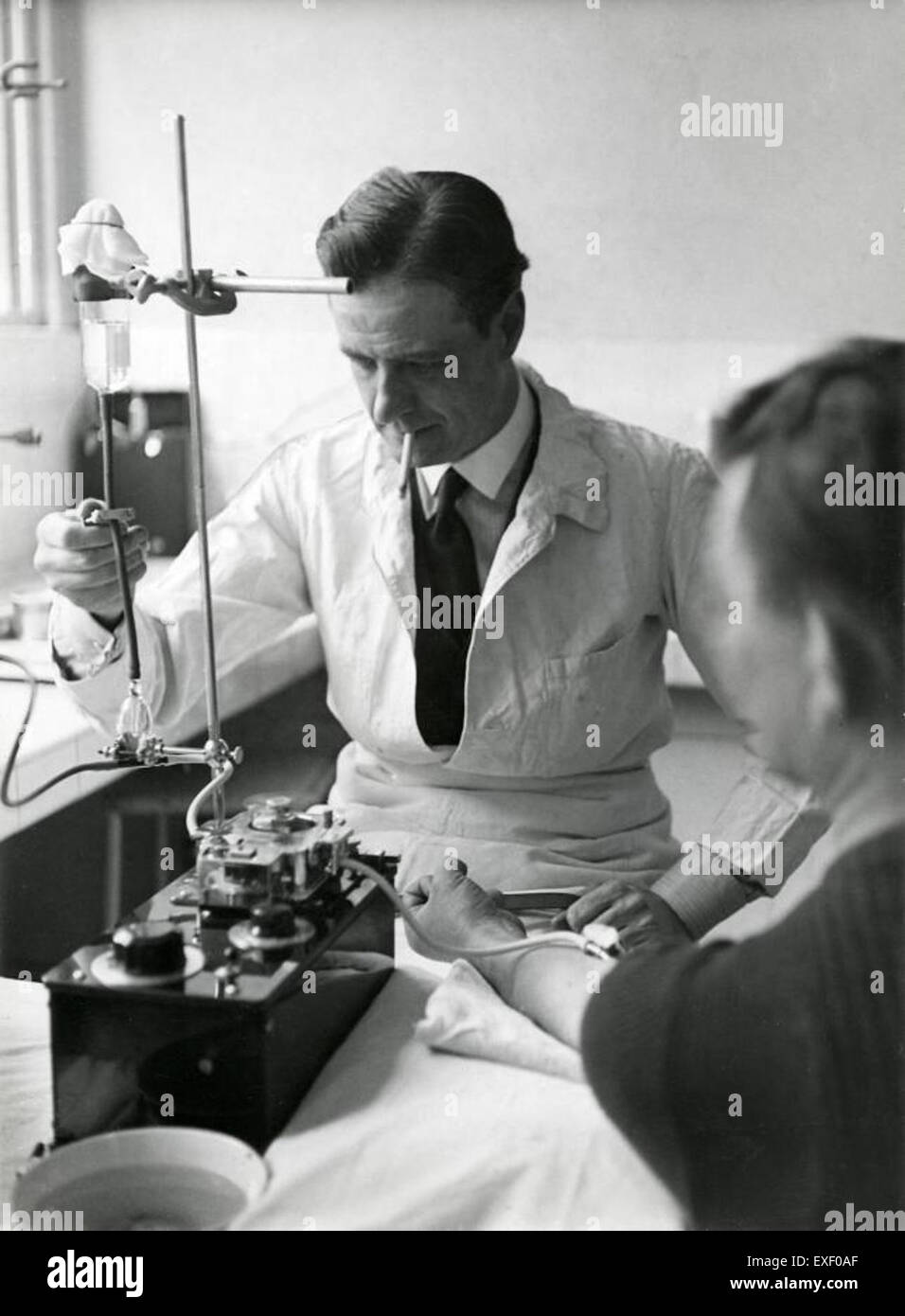 A vintage portrait of a physician depicted while smoking, capturing the ...